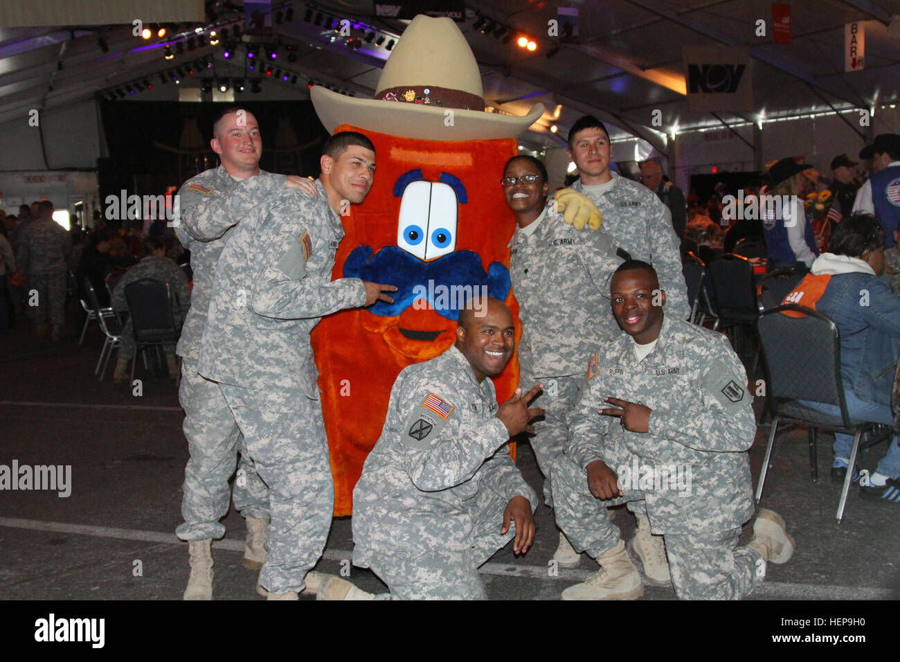 Soldiers from Fort Hood, Texas, pose for a picture with the mascot of ...