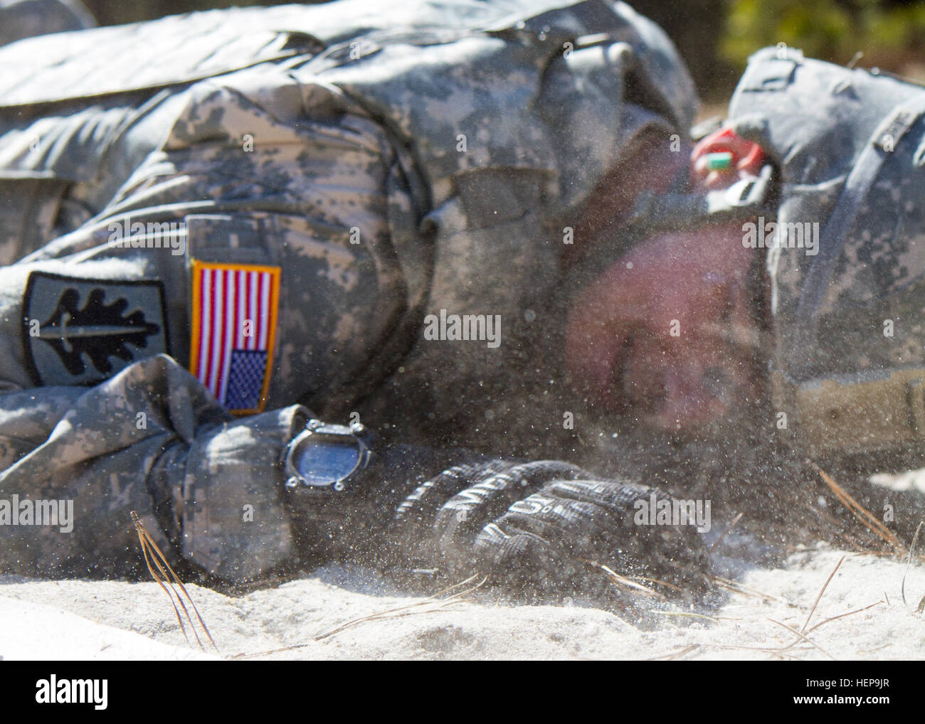 Army Reserve Sgt. Rob Caruso, from Atco, N.J., low crawls during the ...