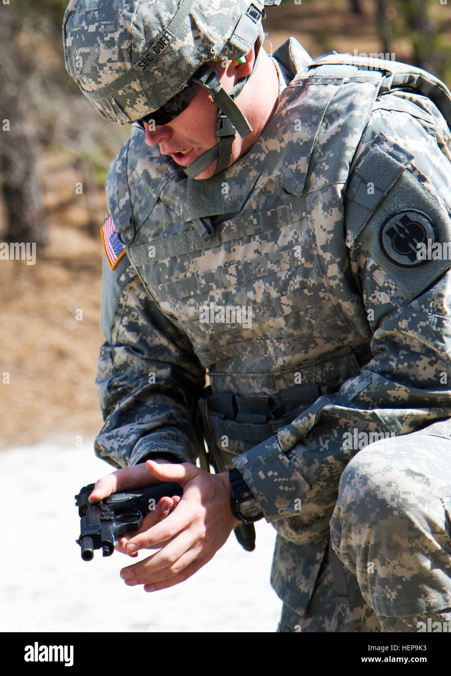 Army Reserve Spc. Michael Goff, 23, a Military Police Soldier, loads ...