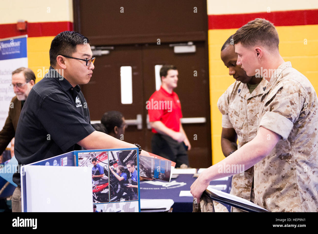 From left, Tony Chau, military admissions representative with Universal ...