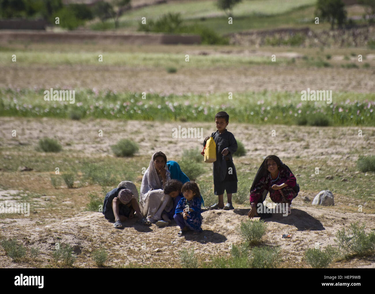 Afghan children observe as Afghan Commandos, with the Afghan National ...