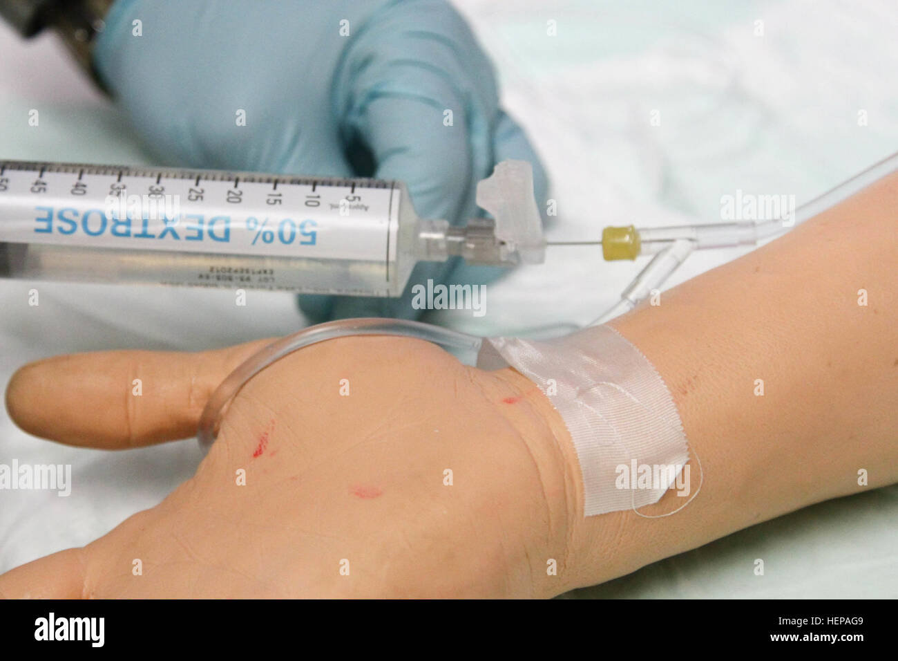 Health care specialists practice starting an IV and pushing medications ...