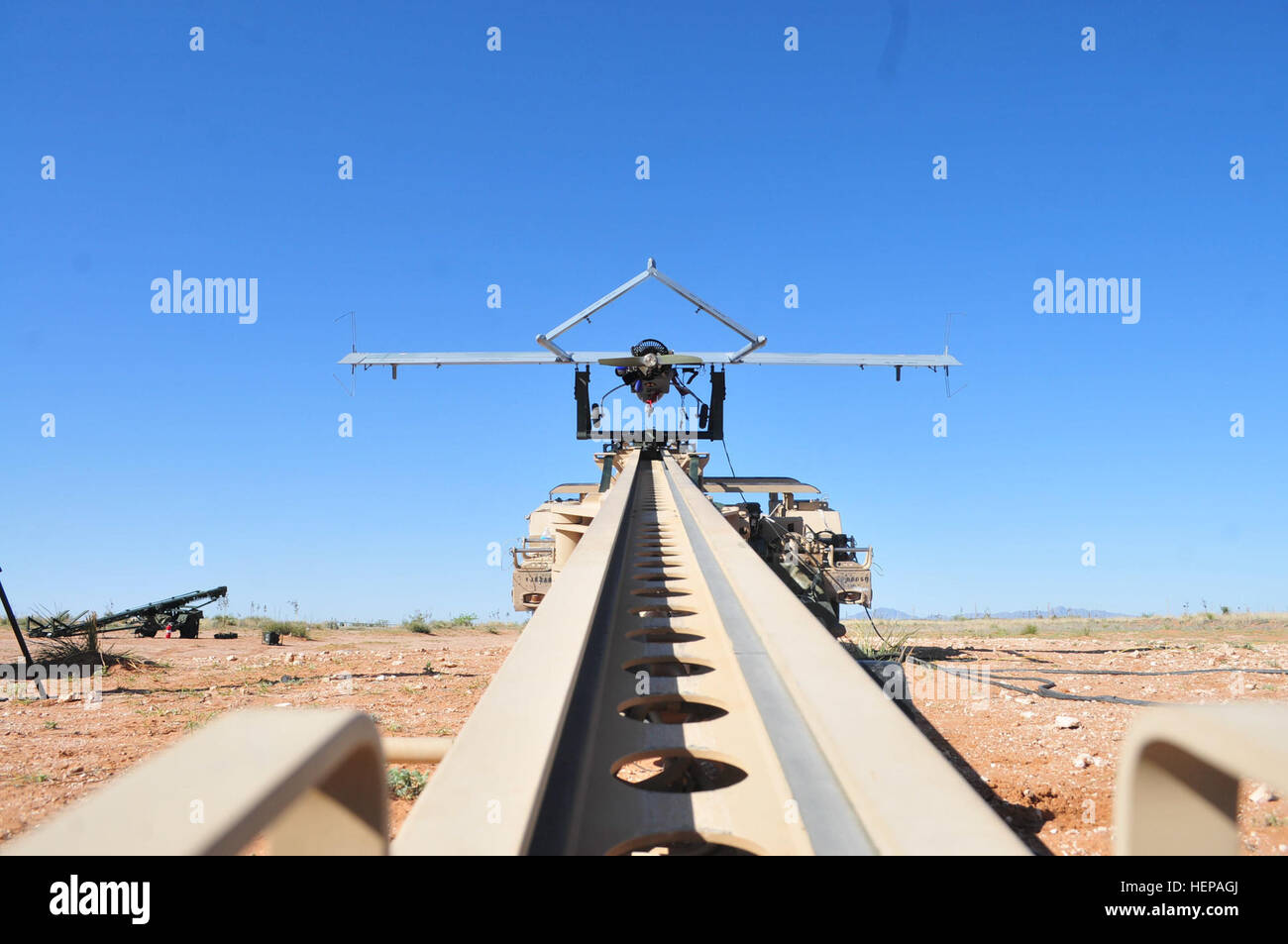 An RQ-7B version 2 Shadow unmanned aerial vehicle sits on a hydraulic ...