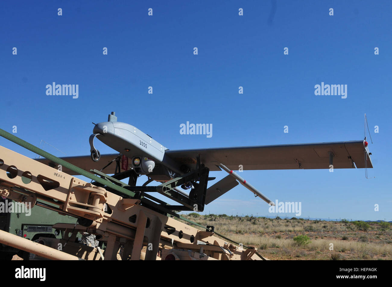 An RQ-7B version 2 Shadow unmanned aerial vehicle sits on a hydraulic ...