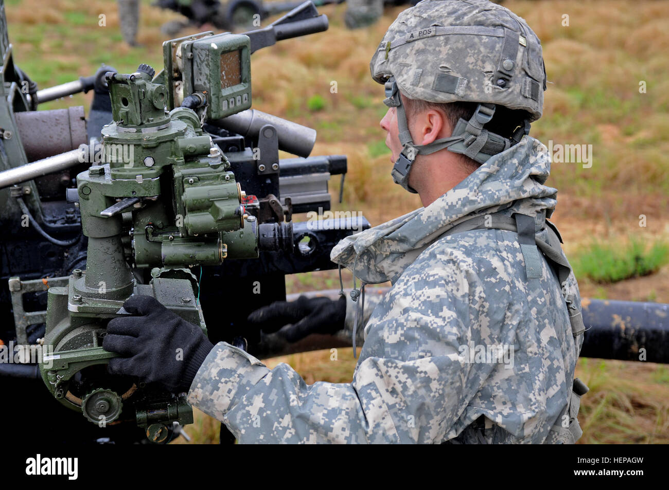 A gunner with Bravo Battery, 2nd Battalion, 319th Airborne Field ...