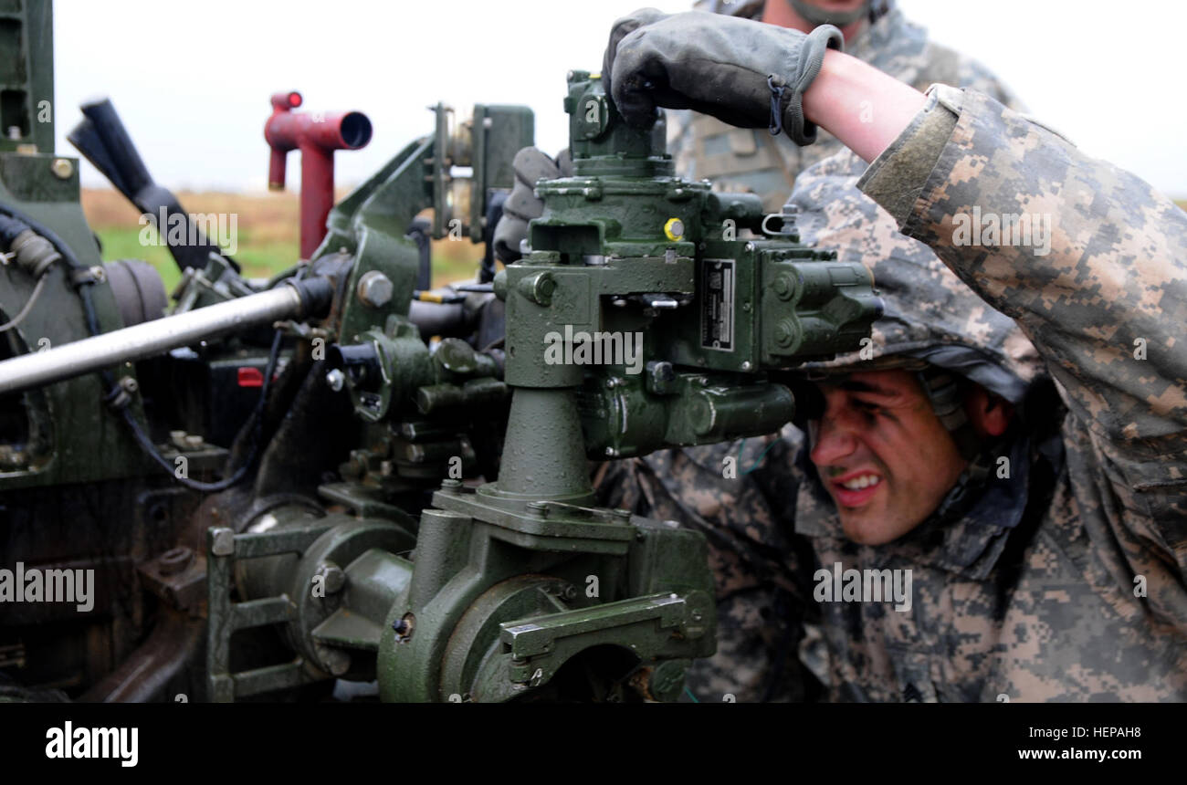 A gunner with Bravo Battery, 2nd Battalion, 319th Airborne Field ...