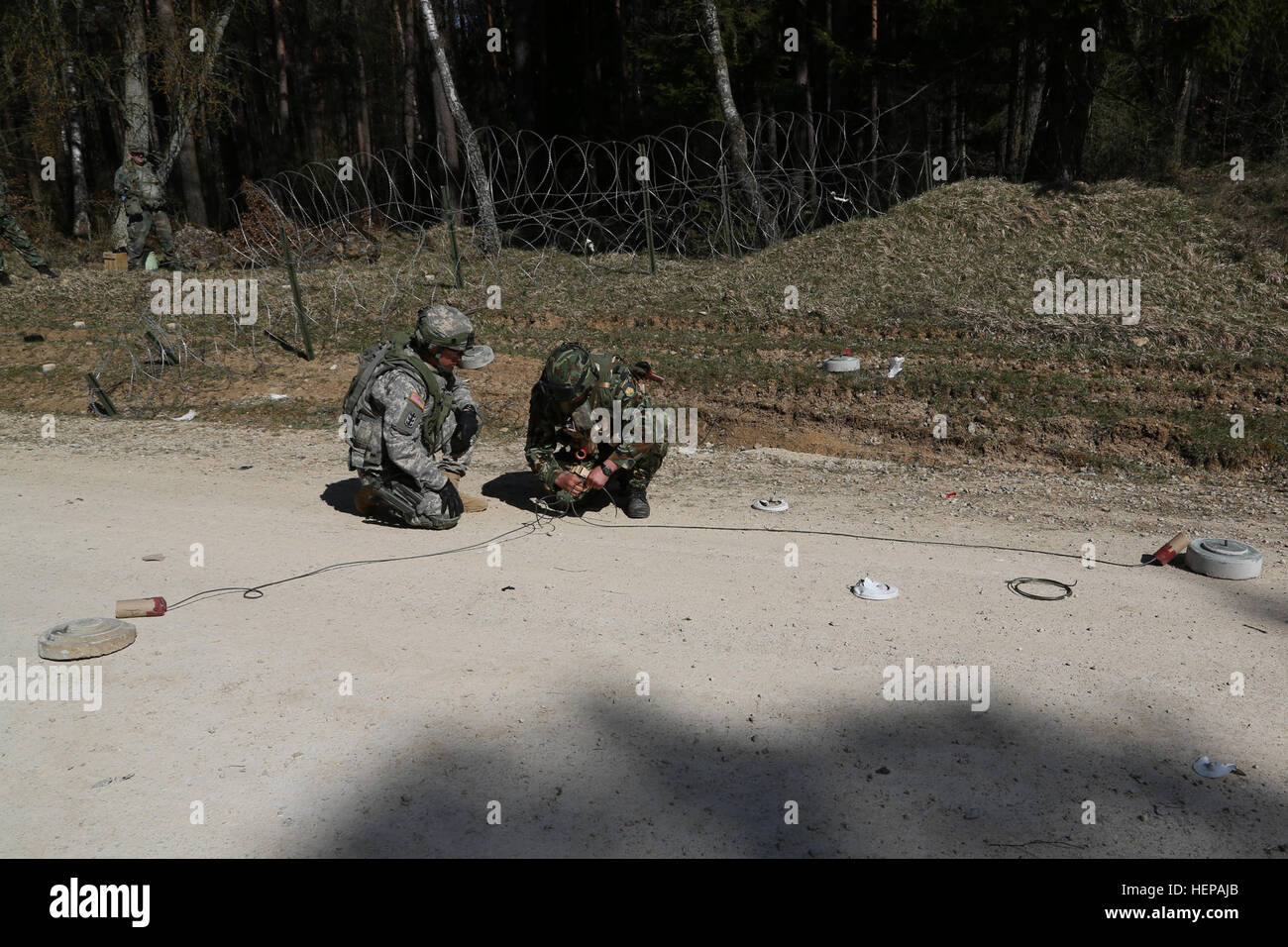 A U.S. Soldier, left, of Alpha Troop, Regimental Engineer Squadron, 2nd ...