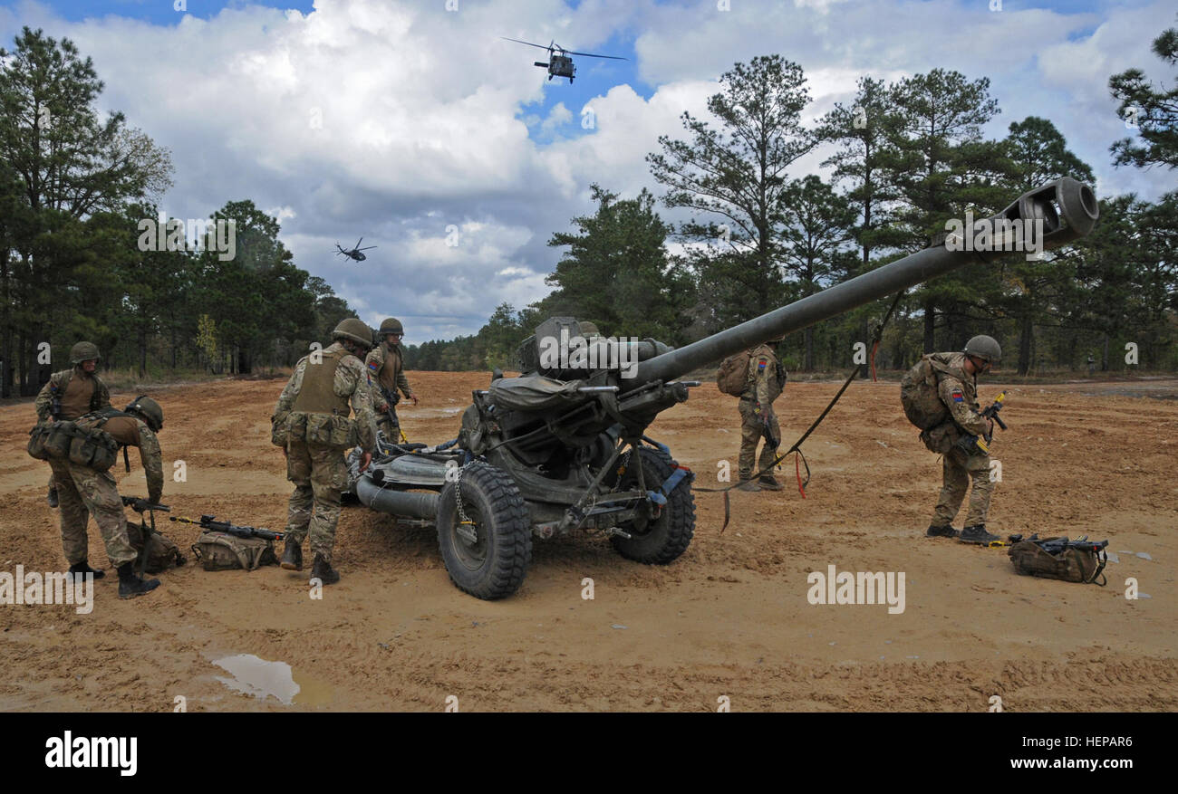 UH 60s sling load two British L118 light guns dropping them and the ...