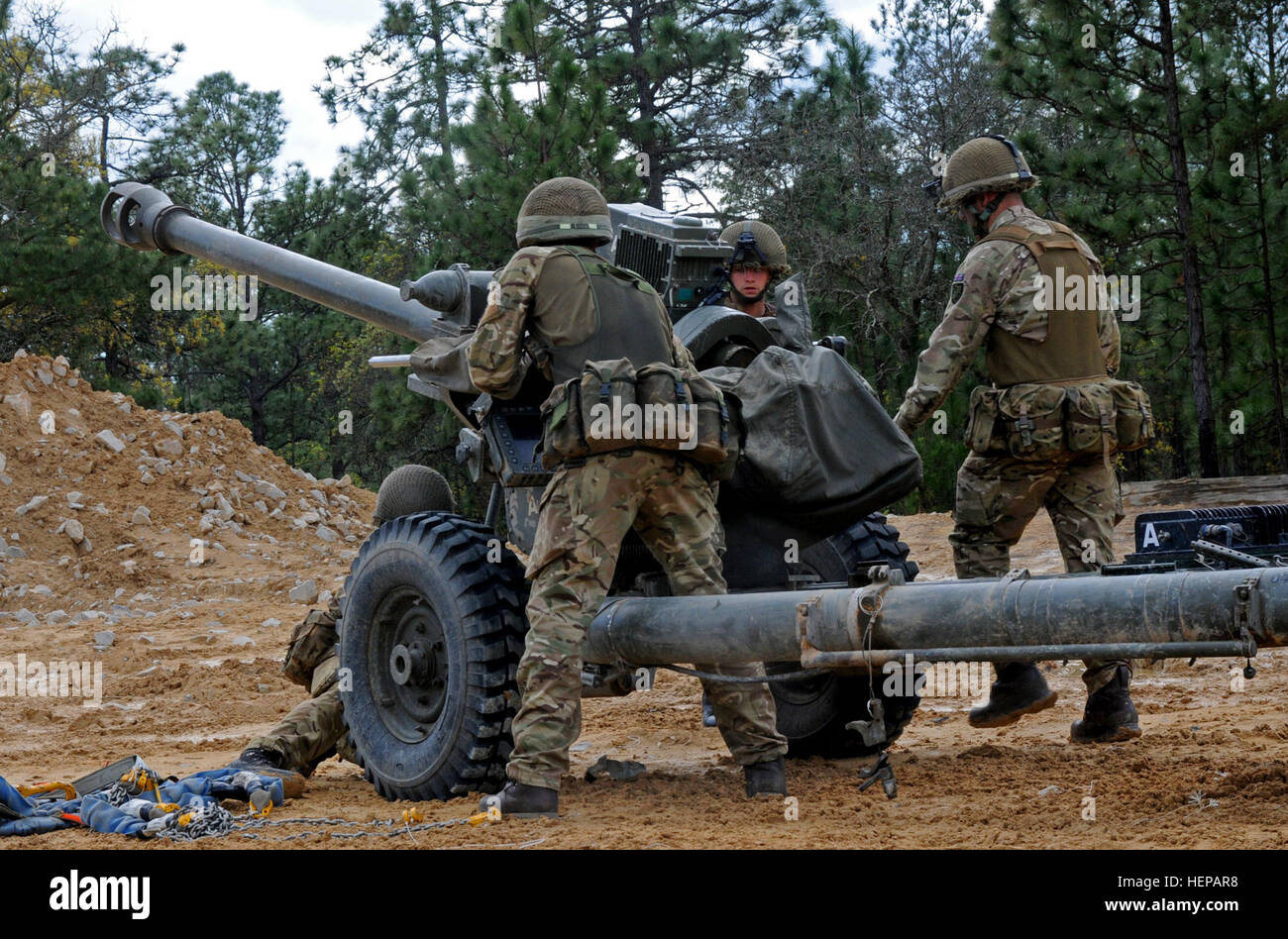 UH 60s sling load two British L118 light guns dropping them and the ...