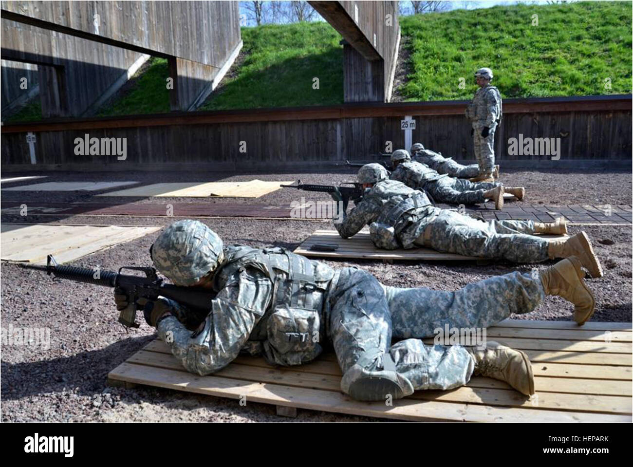 Soldiers from 16th Sustainment Brigade fire their weapons on the M16 ...