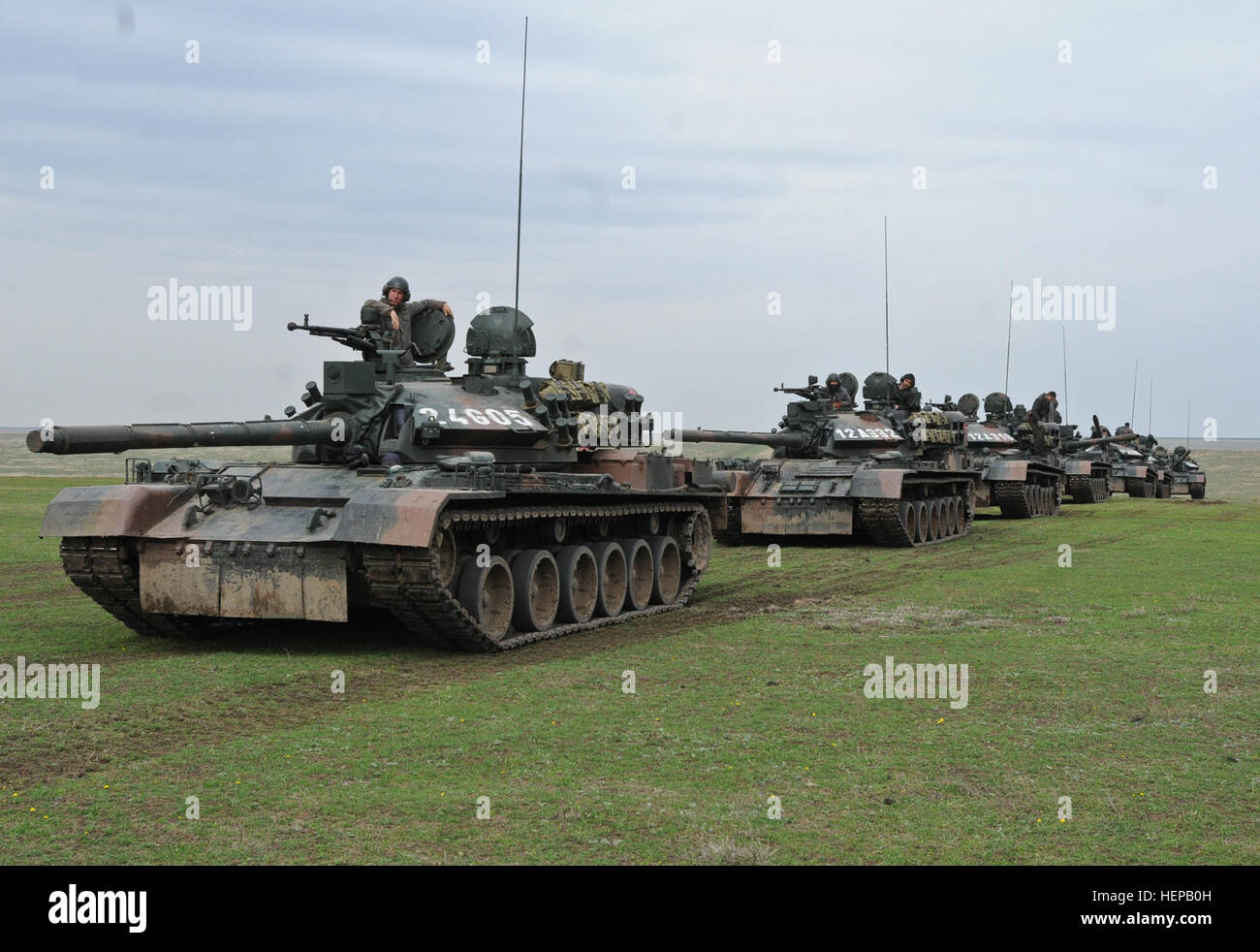 Soldiers belonging to the Romanian Land Forces, continue on towards ...