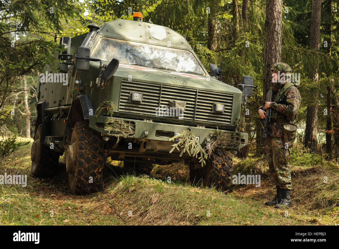 A Luxembourg Army soldier stands guard during exercise Saber Junction ...