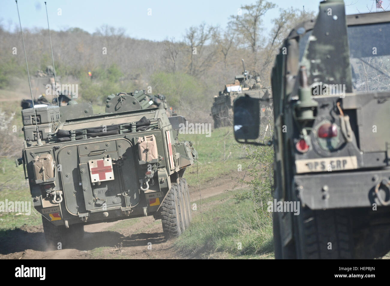 Troopers assigned to 2nd Squadron, 2nd Cavalry Regiment, move in a ...