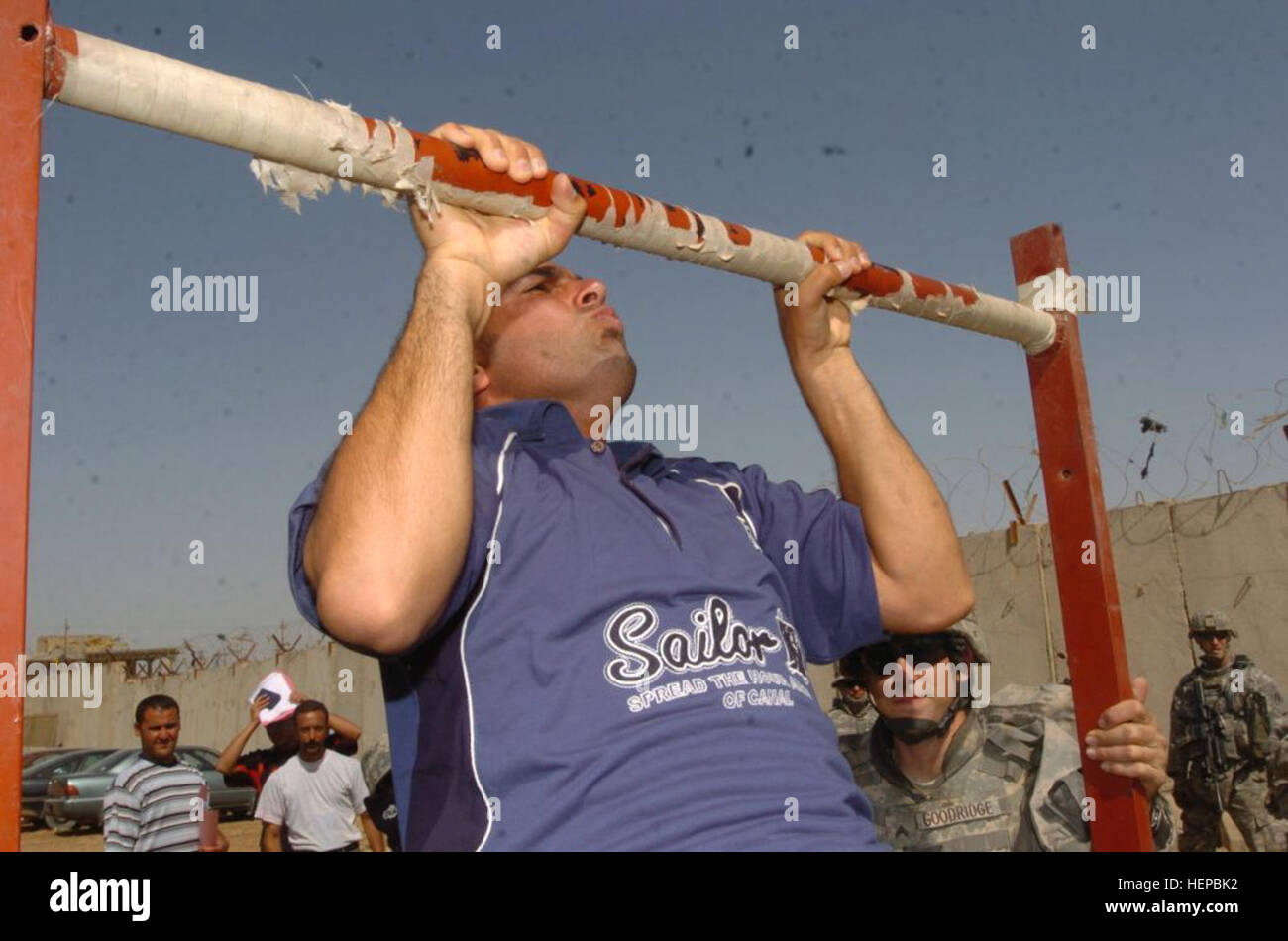 An applicant at the police recruiting drive in Tameem performs pull-ups ...