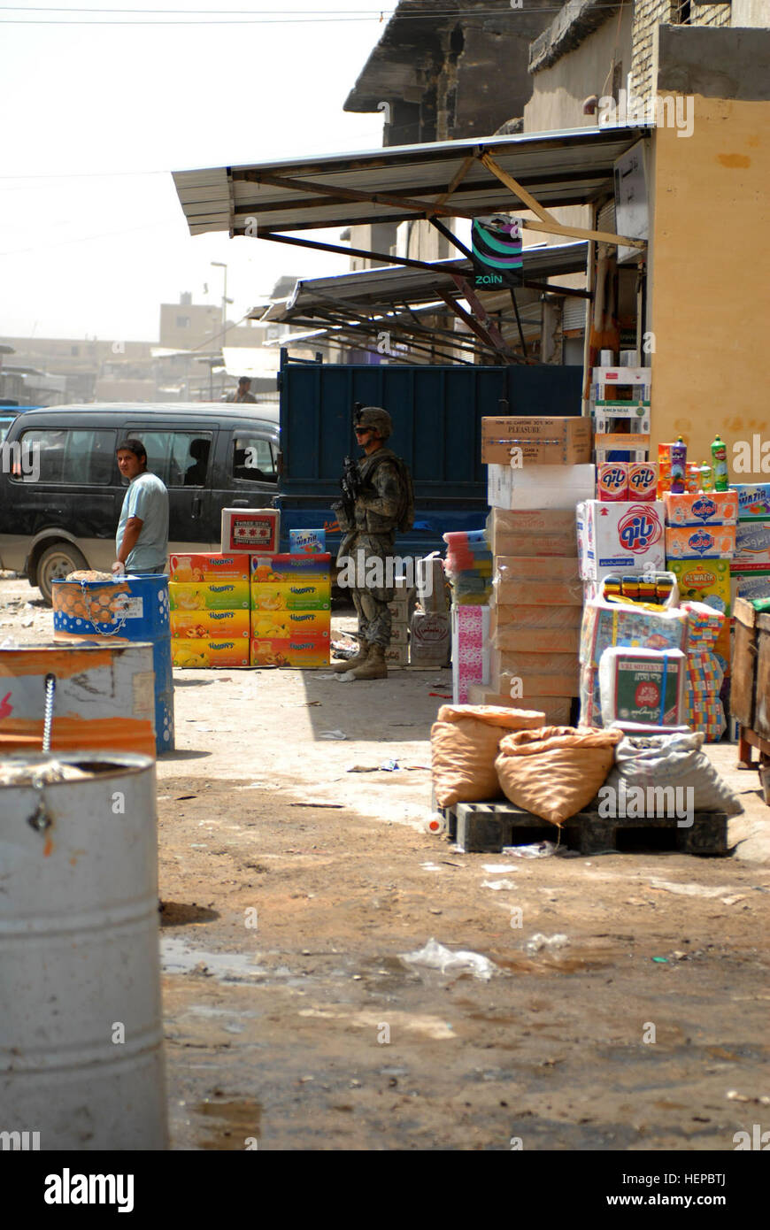 Spc. Philip Davison, a Cincinnati native, seeks the cover of shade ...