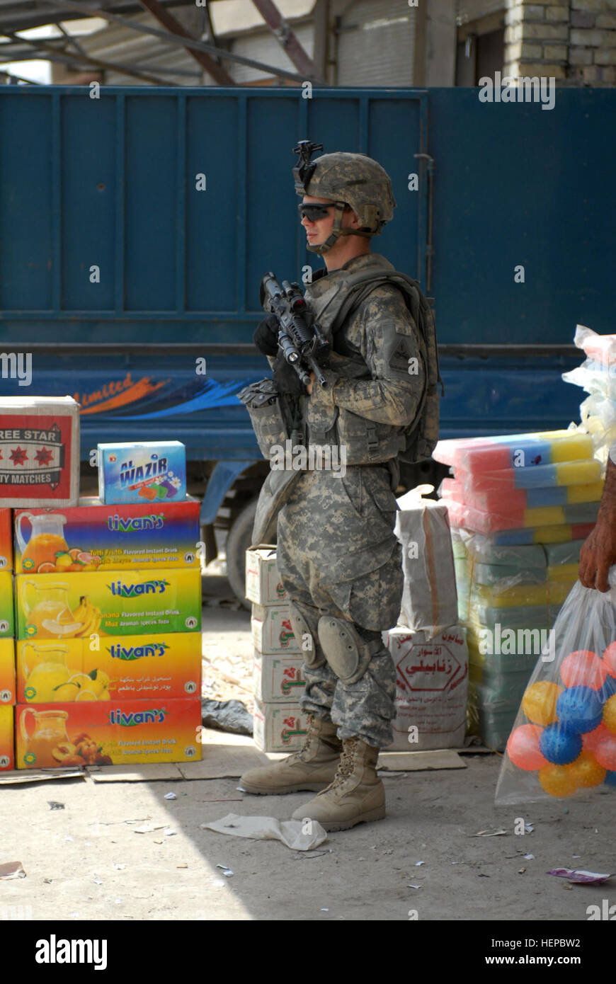 Spc. Philip Davison, a Cincinnati native, seeks the cover of shade ...