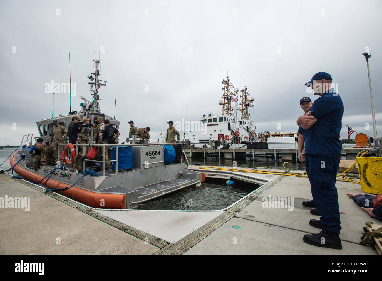 Chief Warrant Officer Nicholas Pavlik and Petty Officer 1st Class Aaron ...