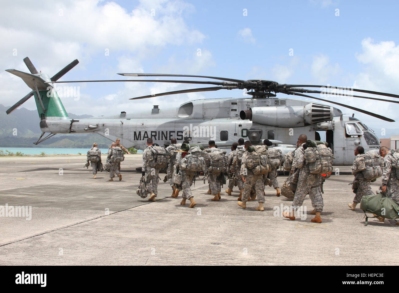 Troops of the 45th Sustainment Brigade prepare to board a Marine Corps ...