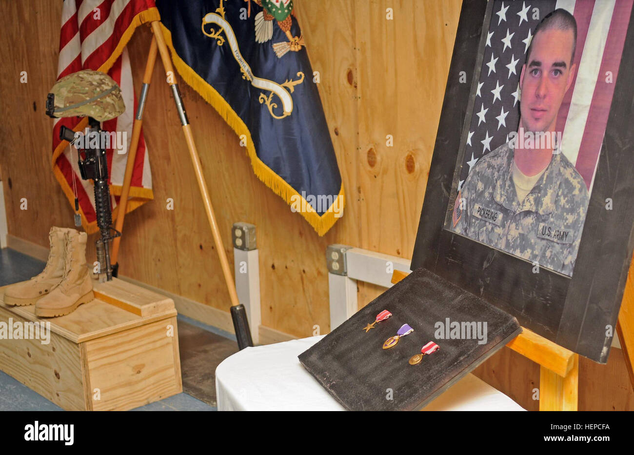A memorial stand, recently earned awards and a photo of U.S. Army Pfc ...
