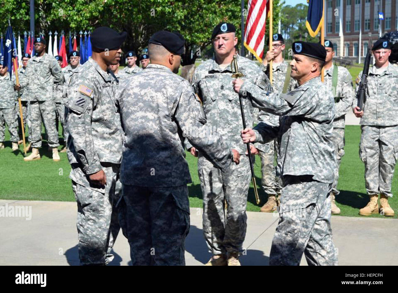 Command Sgt. Maj. Johnny Meadows passes the noncommissioned officer’s ...