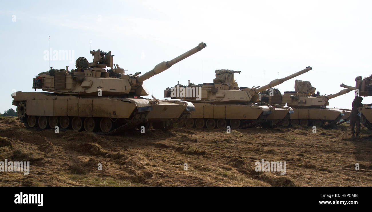 A line of M1A2 Abrams Main Battle Tanks are parked and waiting for ...