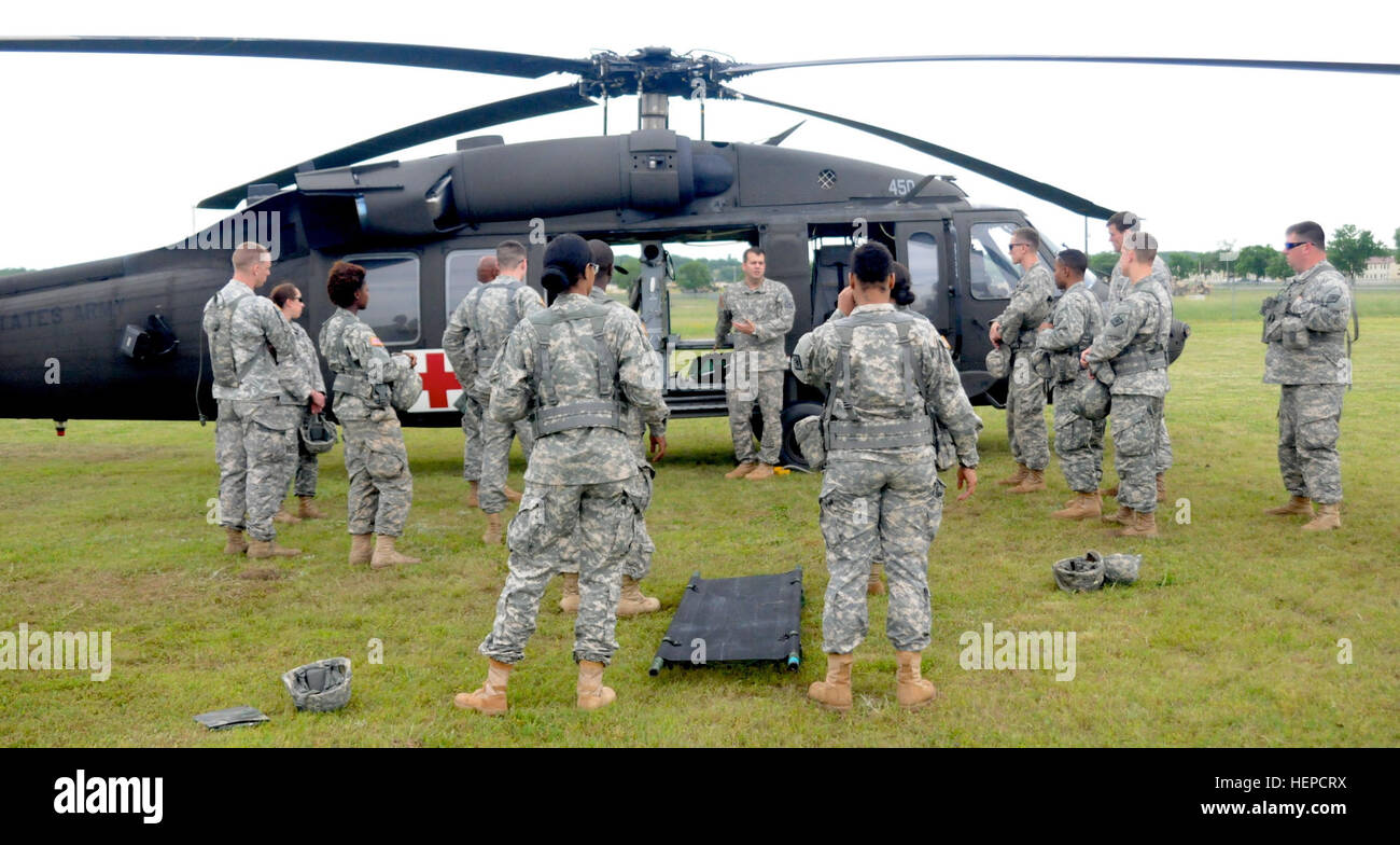 Soldiers with the 213th Medical Company (Area Support) are instructed ...