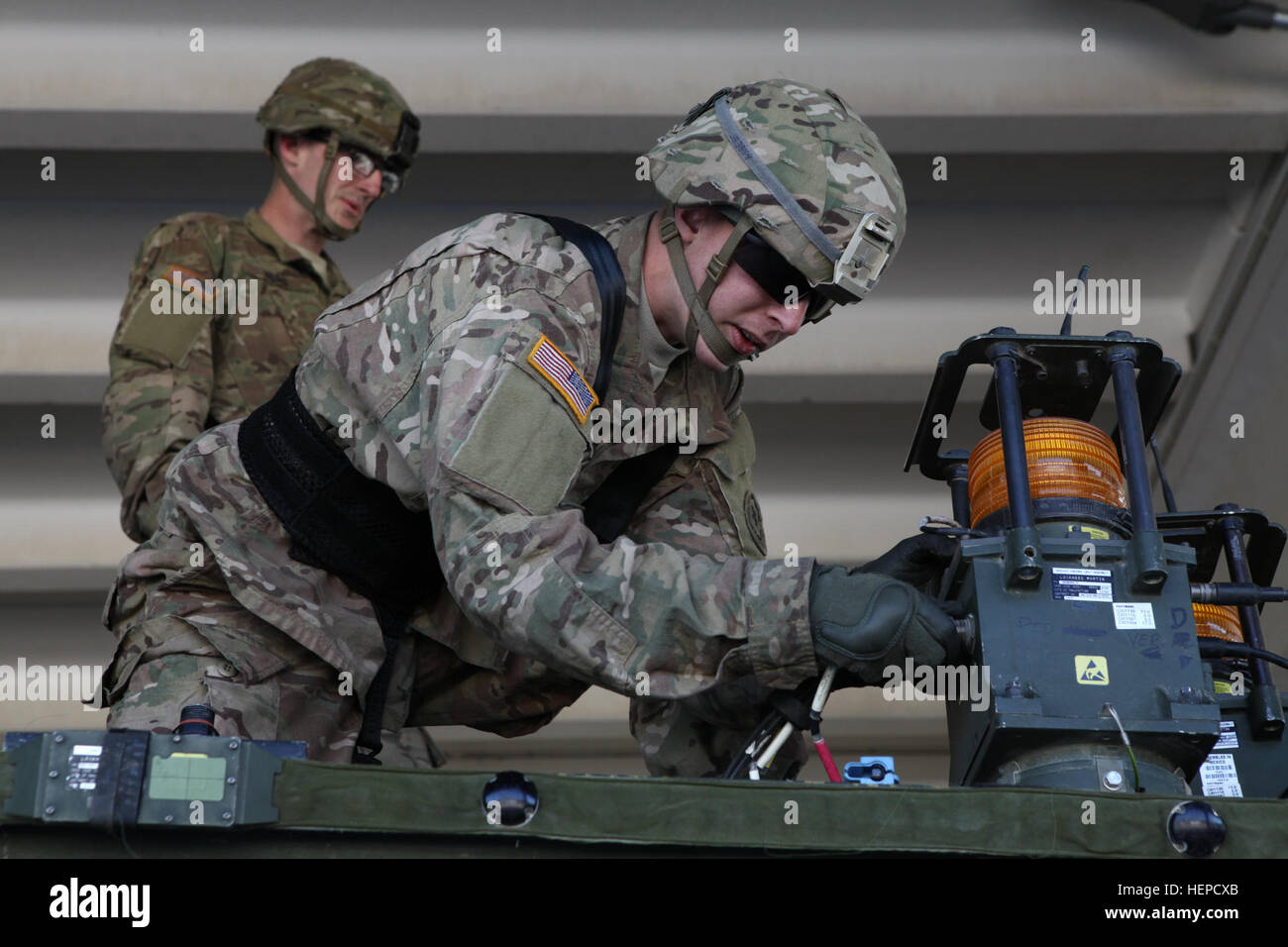 A U.S. Soldier of 3rd Squadron, 2nd Cavalry Regiment installs Multiple ...