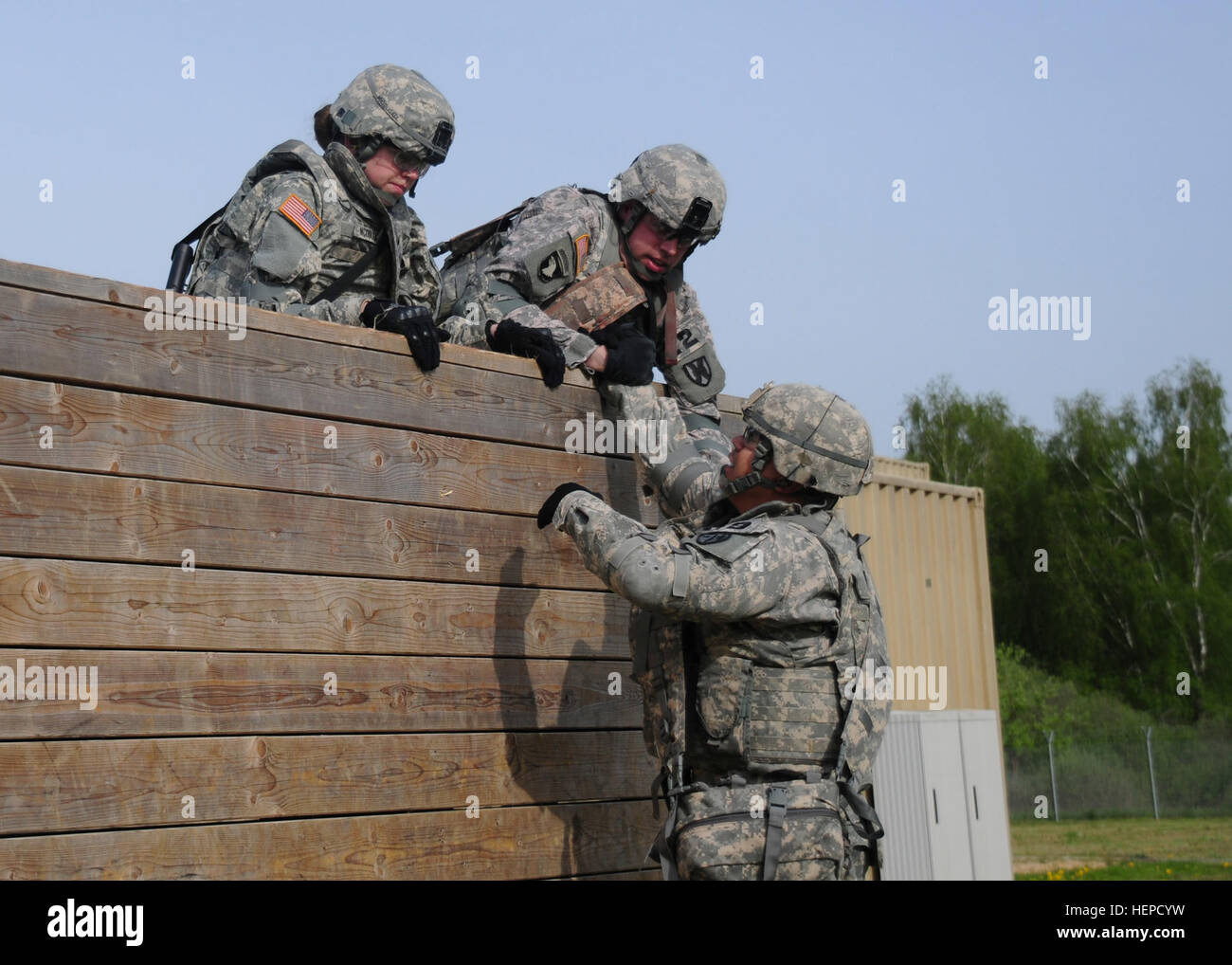 Best Warrior candidates work as a team to navigate a wall obstacle May ...