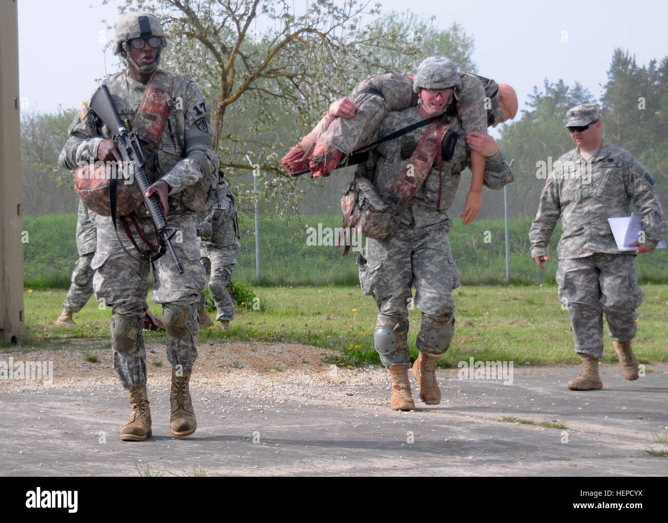 Best Warrior candidates move a simulated casualty to a “safe point” May ...