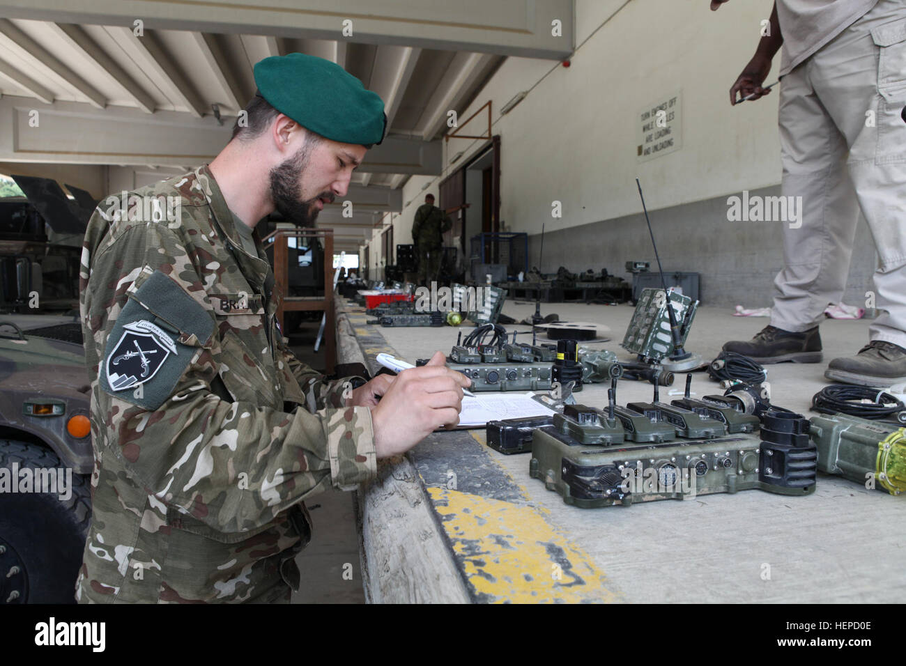 A Slovenian soldier of 1st Brigade signs out Multiple Integrated Laser ...