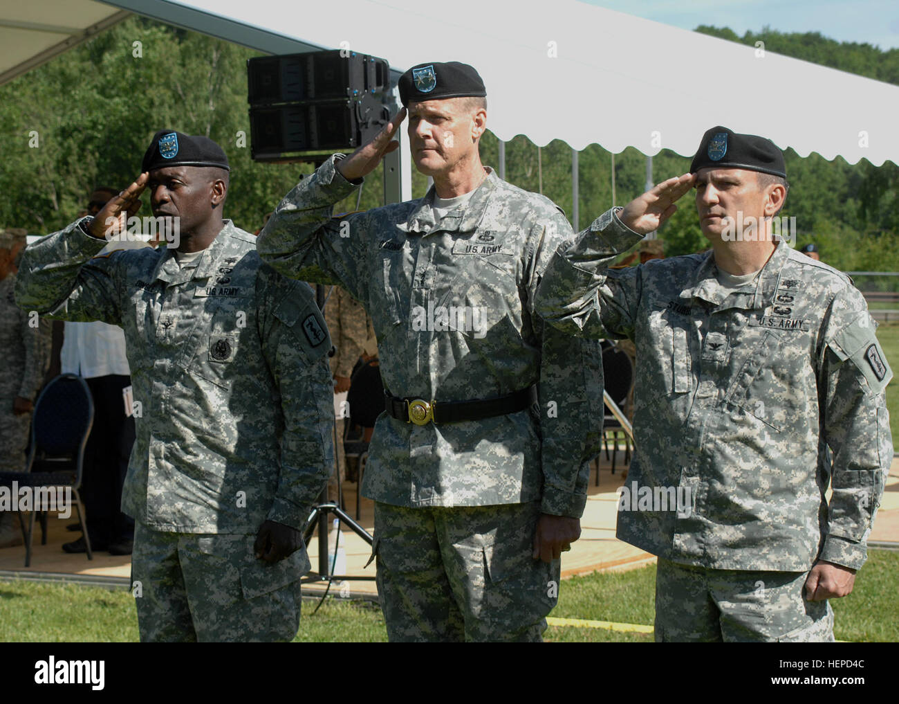 The Reviewing Party presents arms for the playing of the national ...