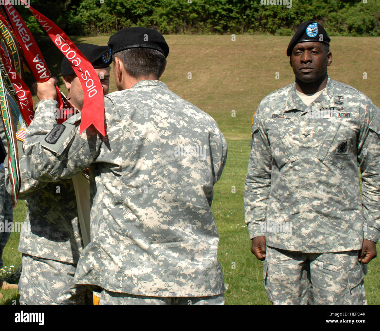 Col. William M. Stubbs passes the colors to his new command sergeant ...