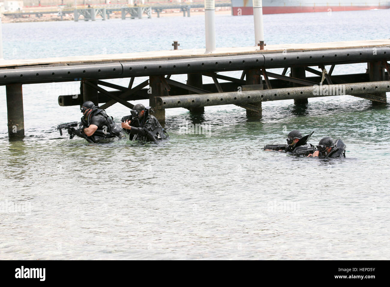 Commandos from the Royal Jordanian Armed Forces emerge from the waters ...