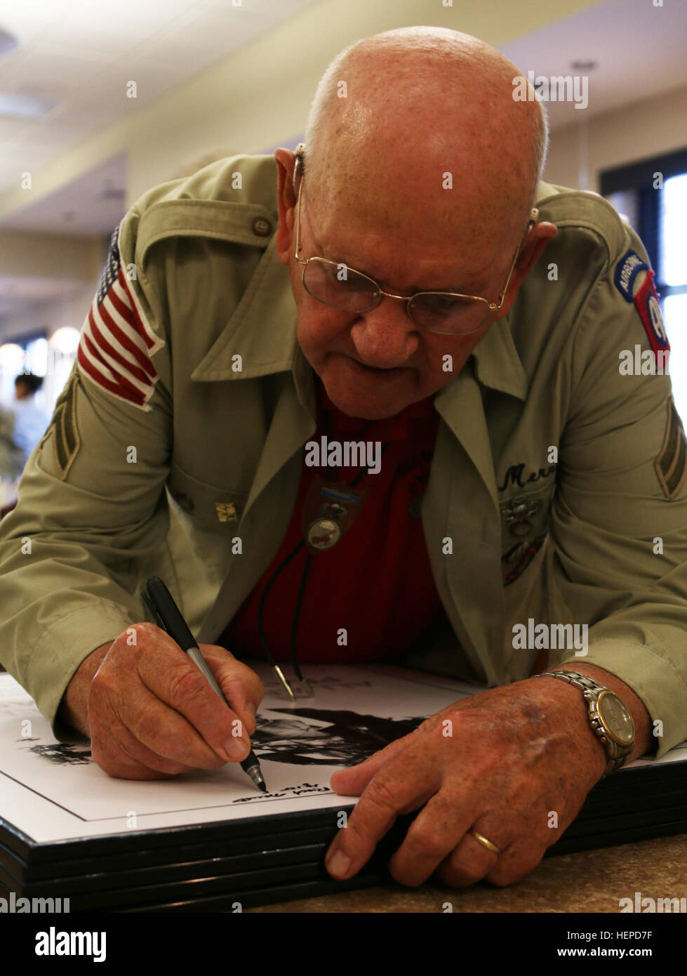 Retired Command Sgt. Maj. Kenneth “Rock” Merritt signs posters after ...