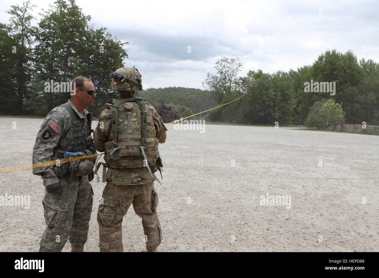 U.S. Army Sgt 1st Class Andrew Deola, left, assigned to Adler Team ...