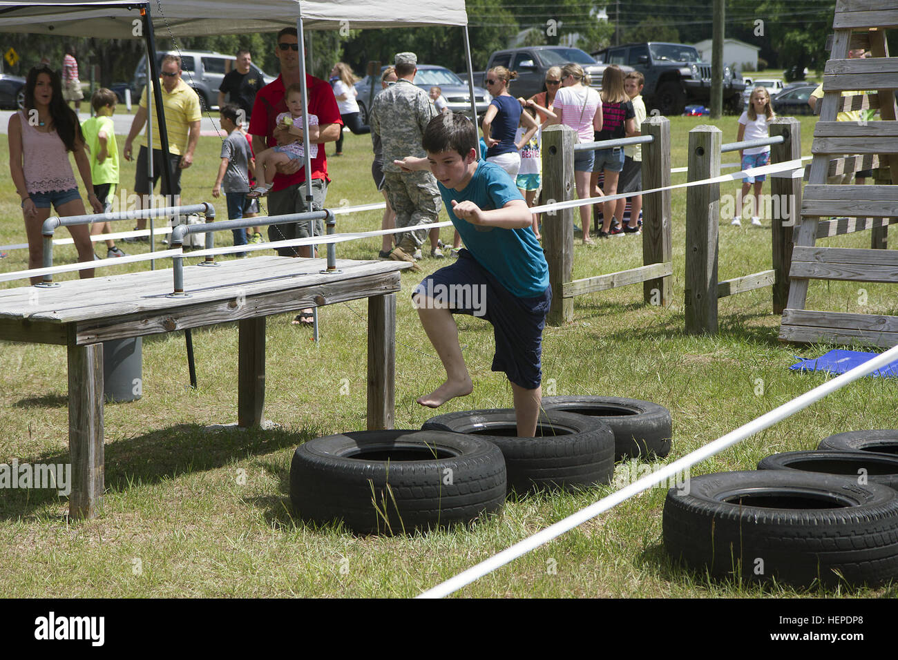 A young boy runs through the obstacle course during Marne Air Day on ...