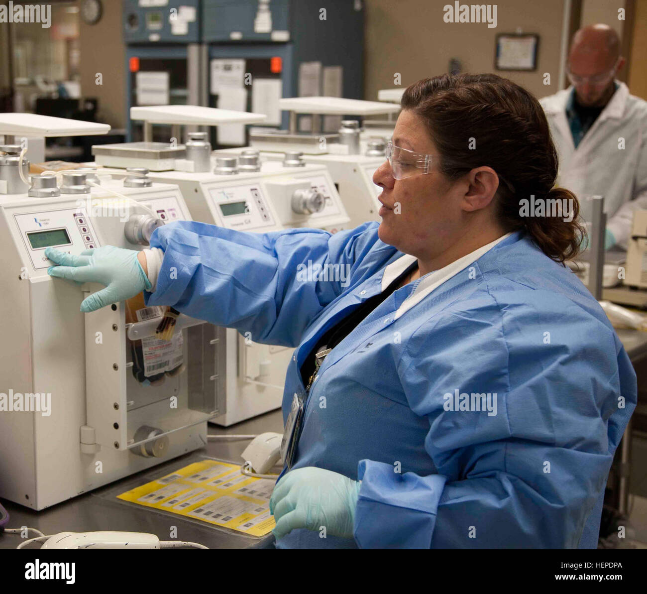 Medical Technician, Allison Hartman, processes blood before ...