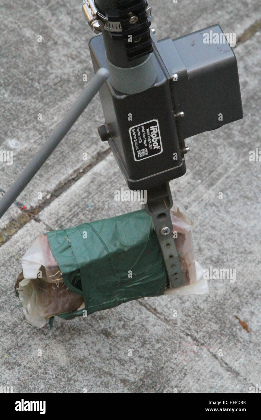 The iRobot 510 PackBot grabs a simulated explosive during a training ...