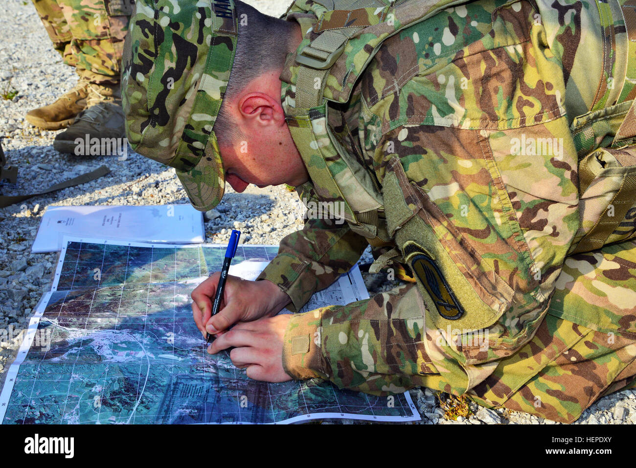 A U.S. Army paratrooper plots targets on a map during Adriatic Strike ...