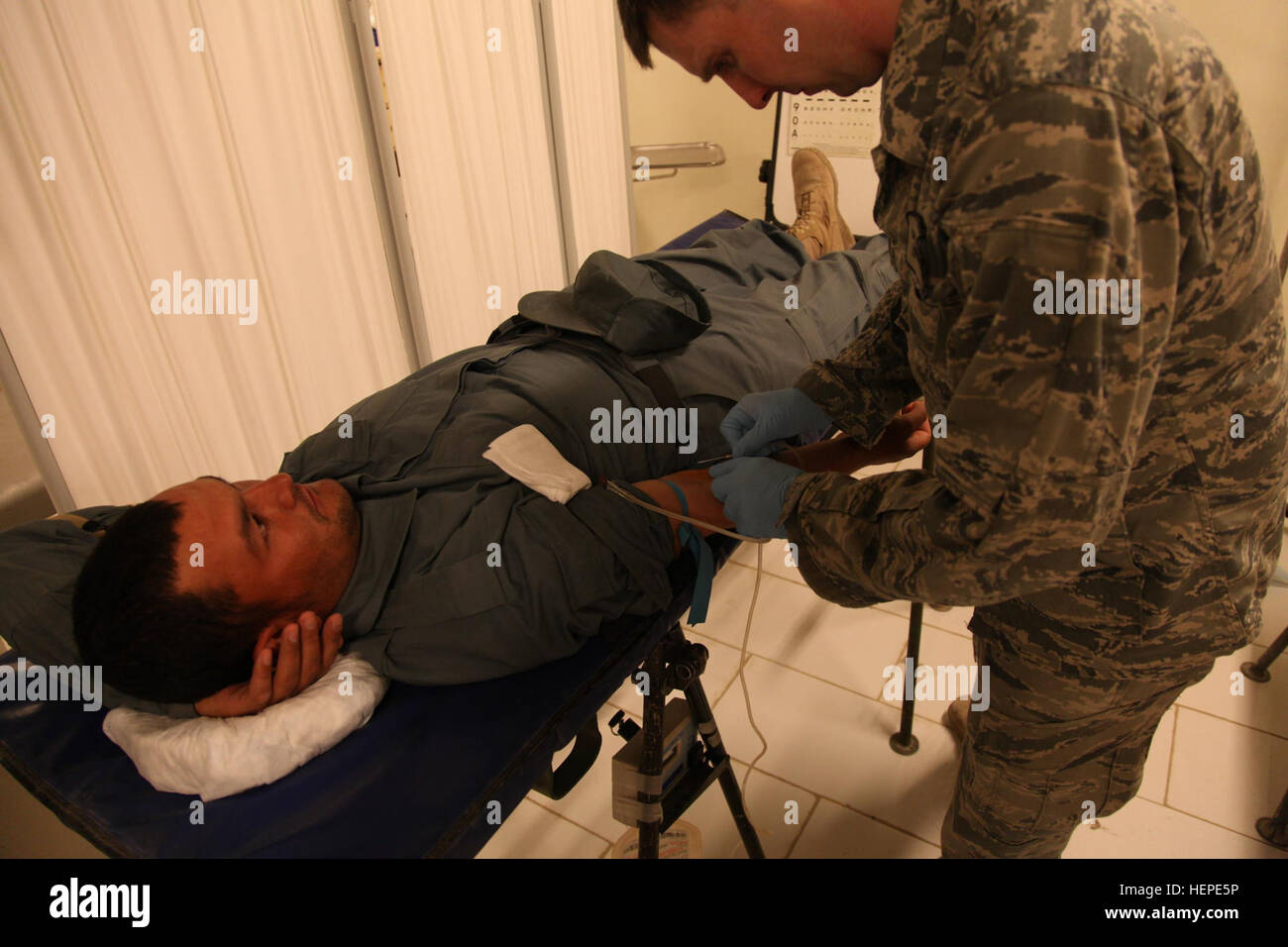 A U.S. Air Force medic collects a blood donation from an Afghan ...