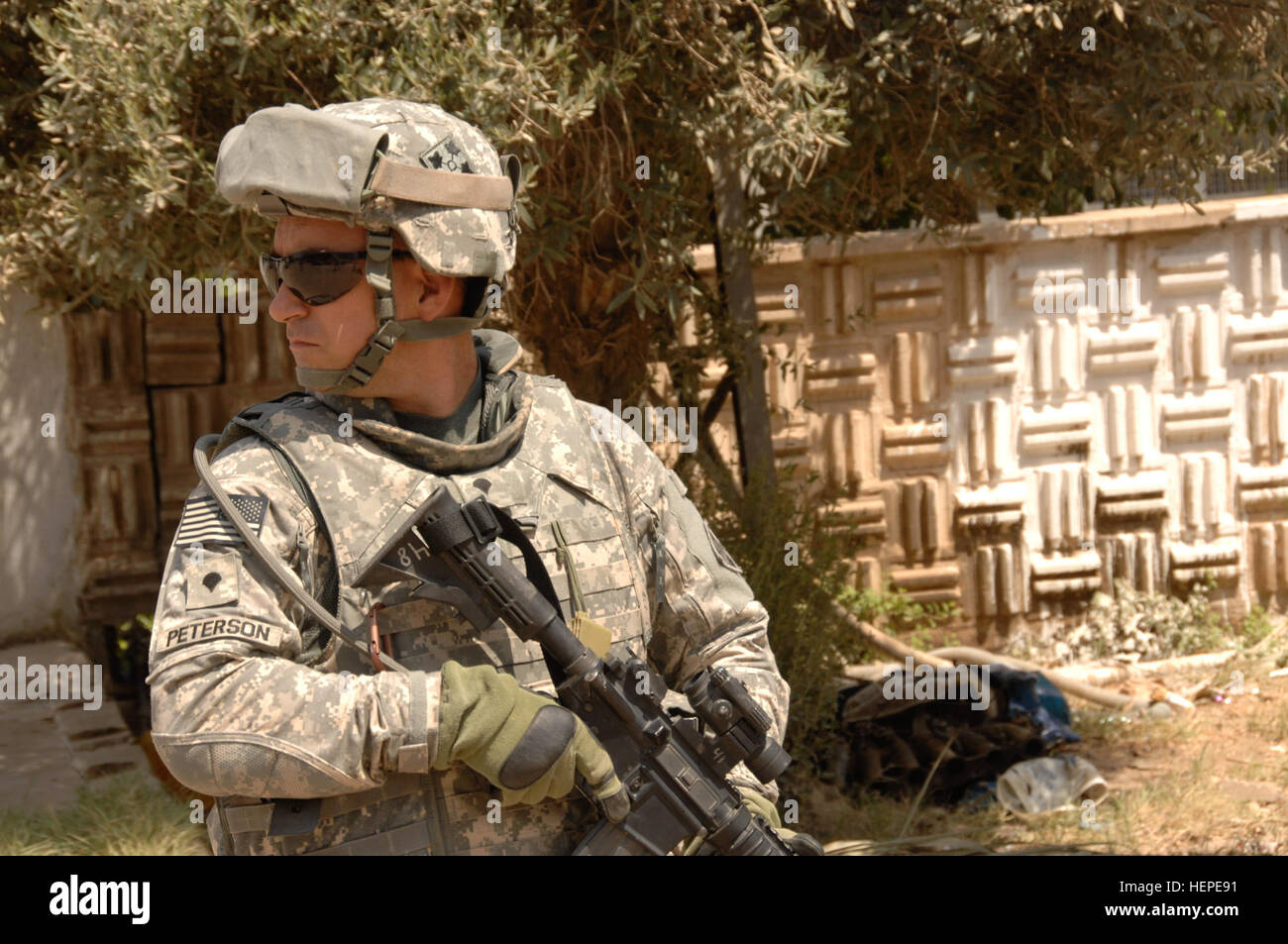 U.S. Army Spc. Shawn Peterson of Britt, Iowa, provides security while ...