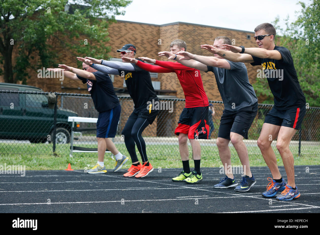 U.S. Army athletes warm up during track training for the 2015 ...
