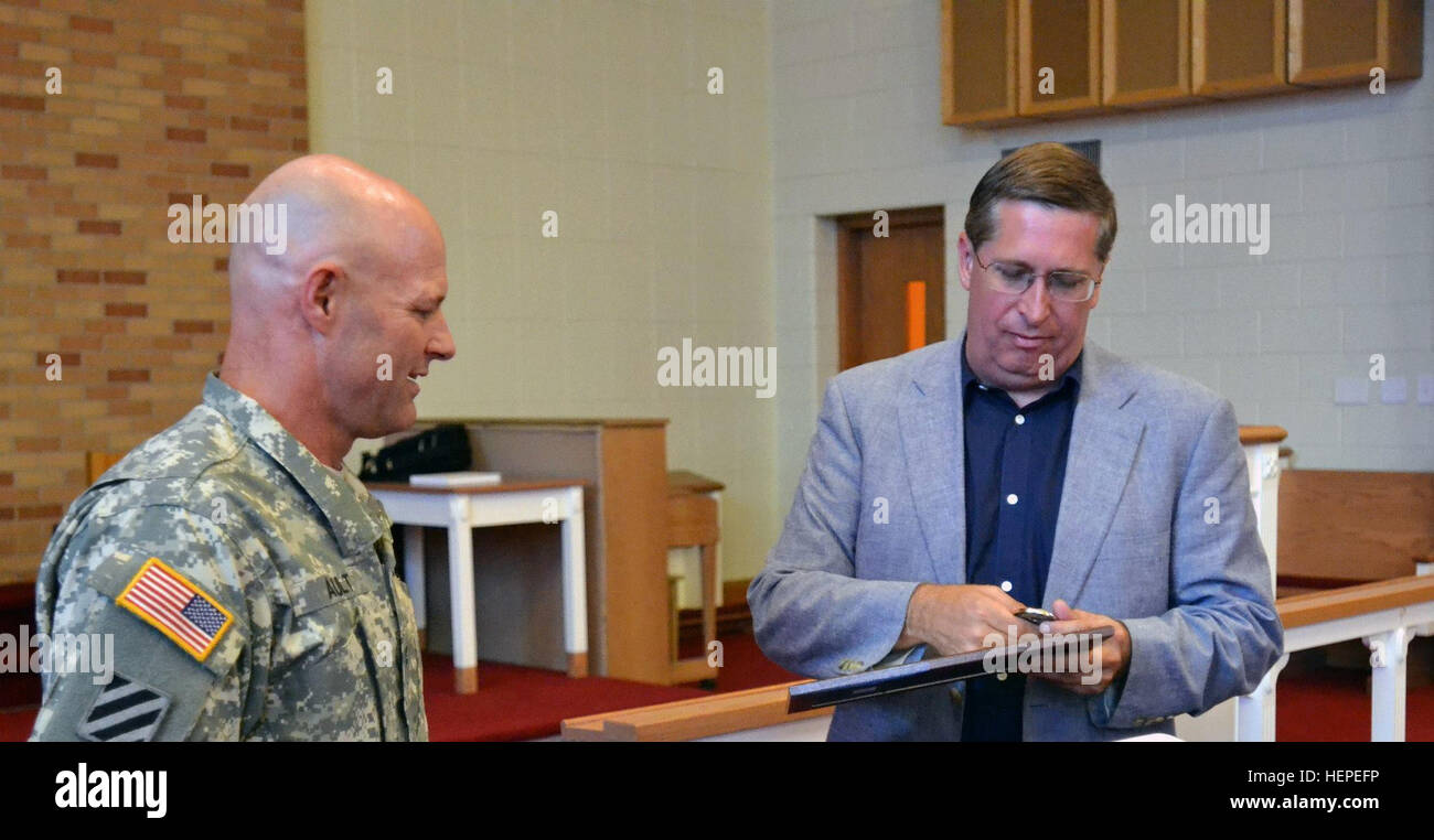 Col. Robert T. Ault, commander, and Command Sgt. Maj. Antoine ...