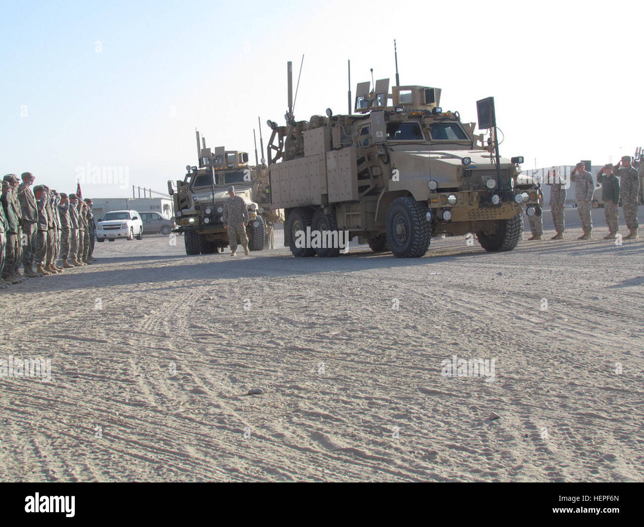 Soldiers of Able Troop salute returning comrades at Camp Buehring ...