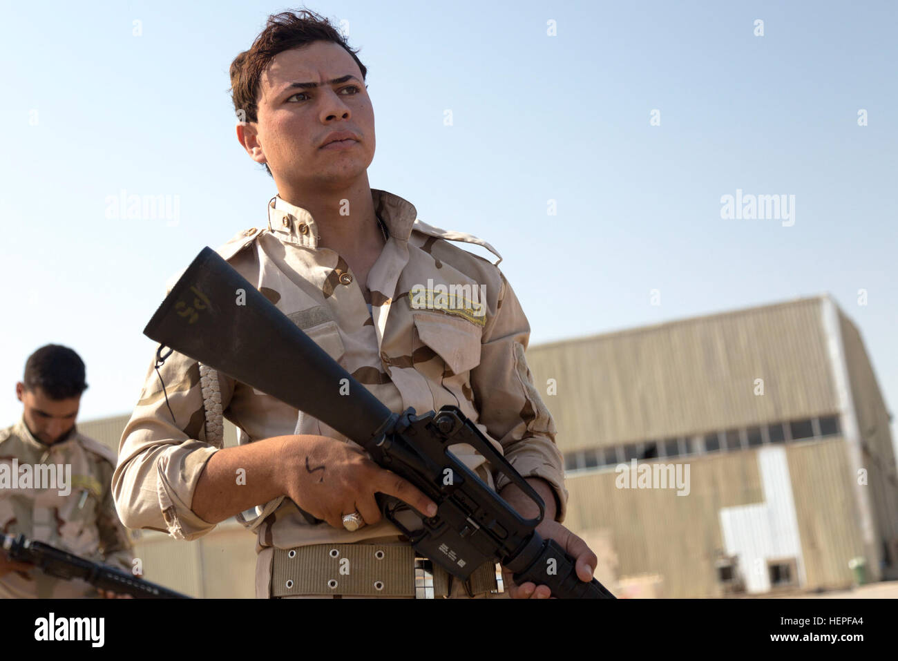 An Iraqi soldier, assigned to the 73rd Brigade, 16th Division, listens ...