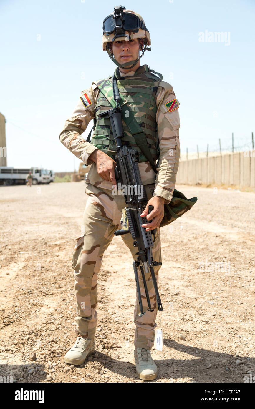 An Iraqi soldier, assigned to the 73rd Brigade, 16th Division, poses ...