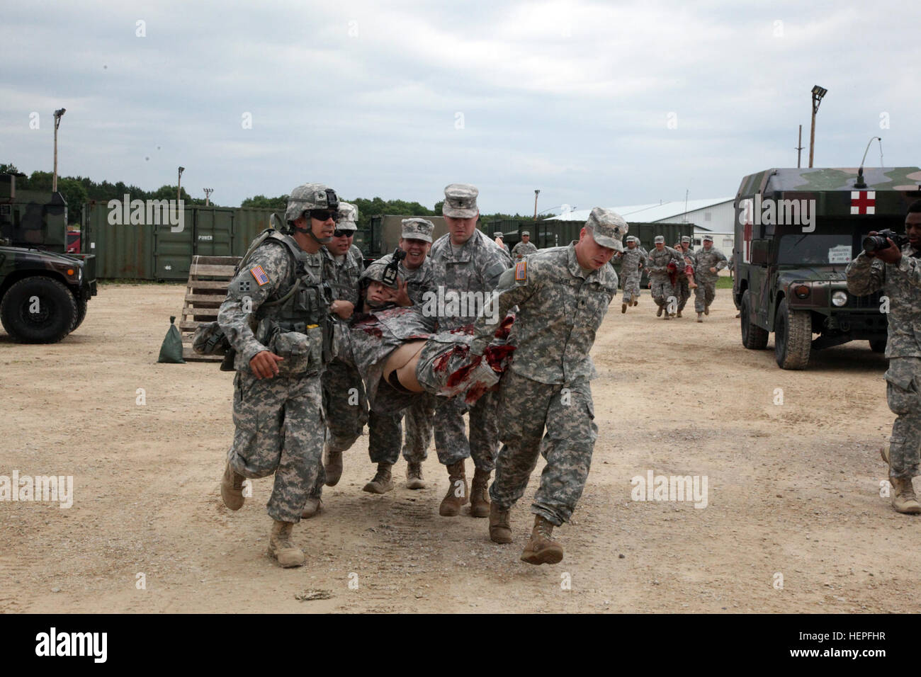 U.S. Army Reserve Soldiers in a training scenario run with a simulated ...