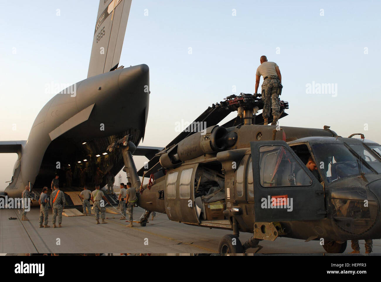 Crews from 3rd Battalion, 158th Aviation Regiment (Assault) prepare to ...