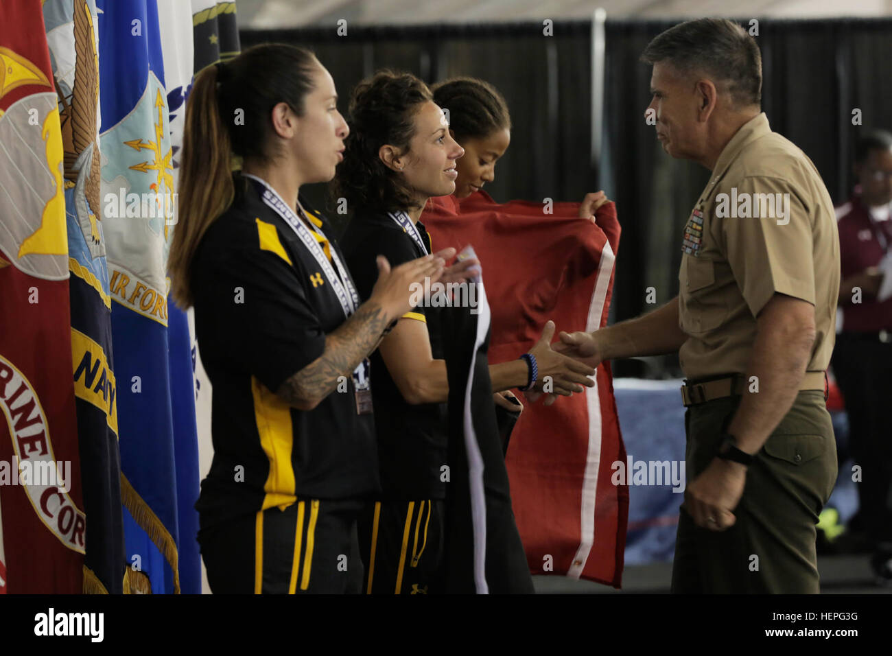 U.S. Army Capt. Kelly Elmlinger, San Antonio, receives the gold medal ...