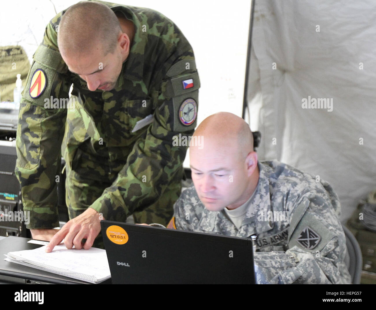Capt. Dan Matejka, a Czech communications officer, and Chief Warrant ...